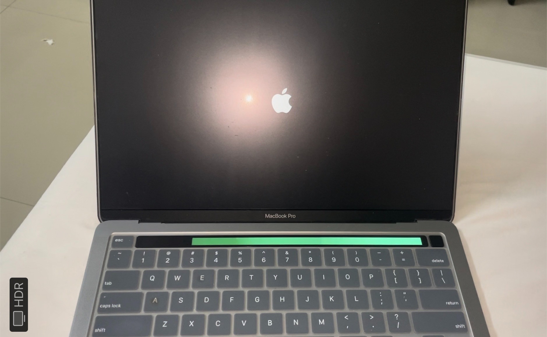 M1 Macbook pro TouchBar showing green tin… - Apple Community