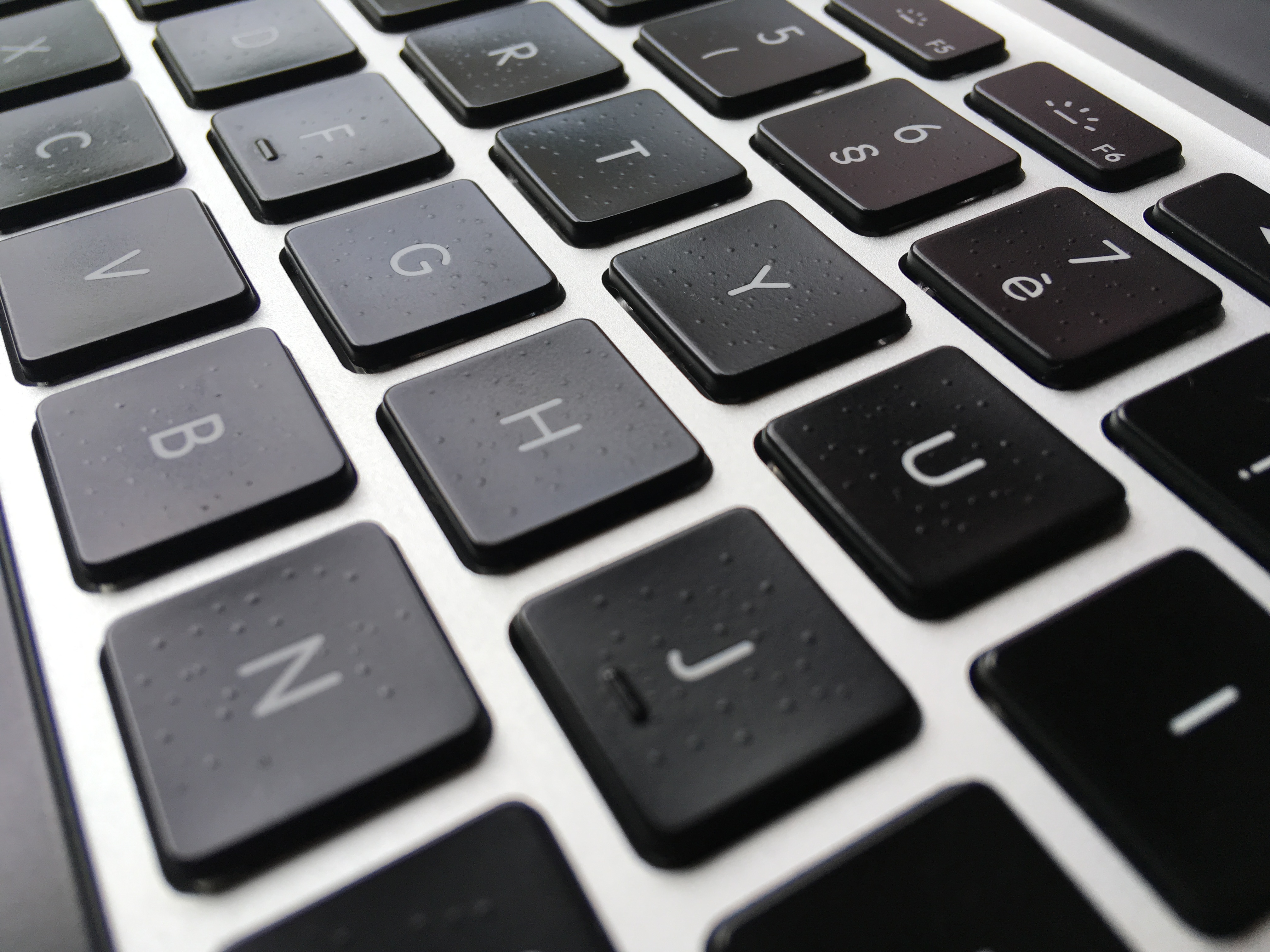 Tiny bubbles on keyboard and MacBook pro … - Apple Community